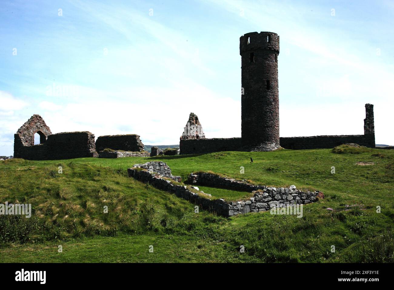 The 11th.Century Round tower and ruins of St.Patrick's Church in Peel Castle at Peel in the Isle ...
