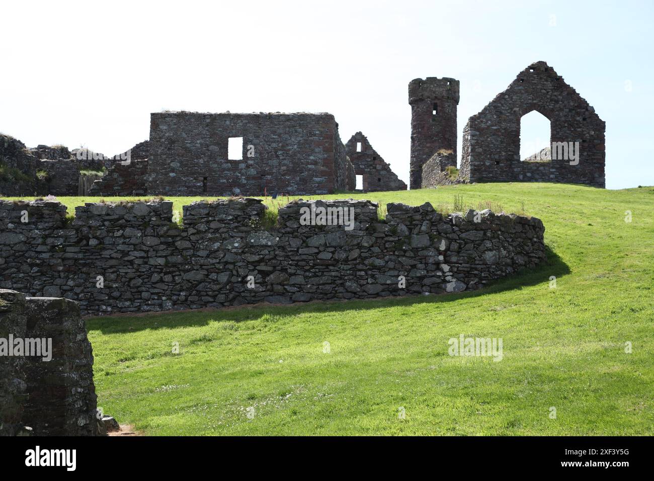 The 11th.Century Round tower and ruins of St.Patrick's Church in Peel Castle at Peel in the Isle ...