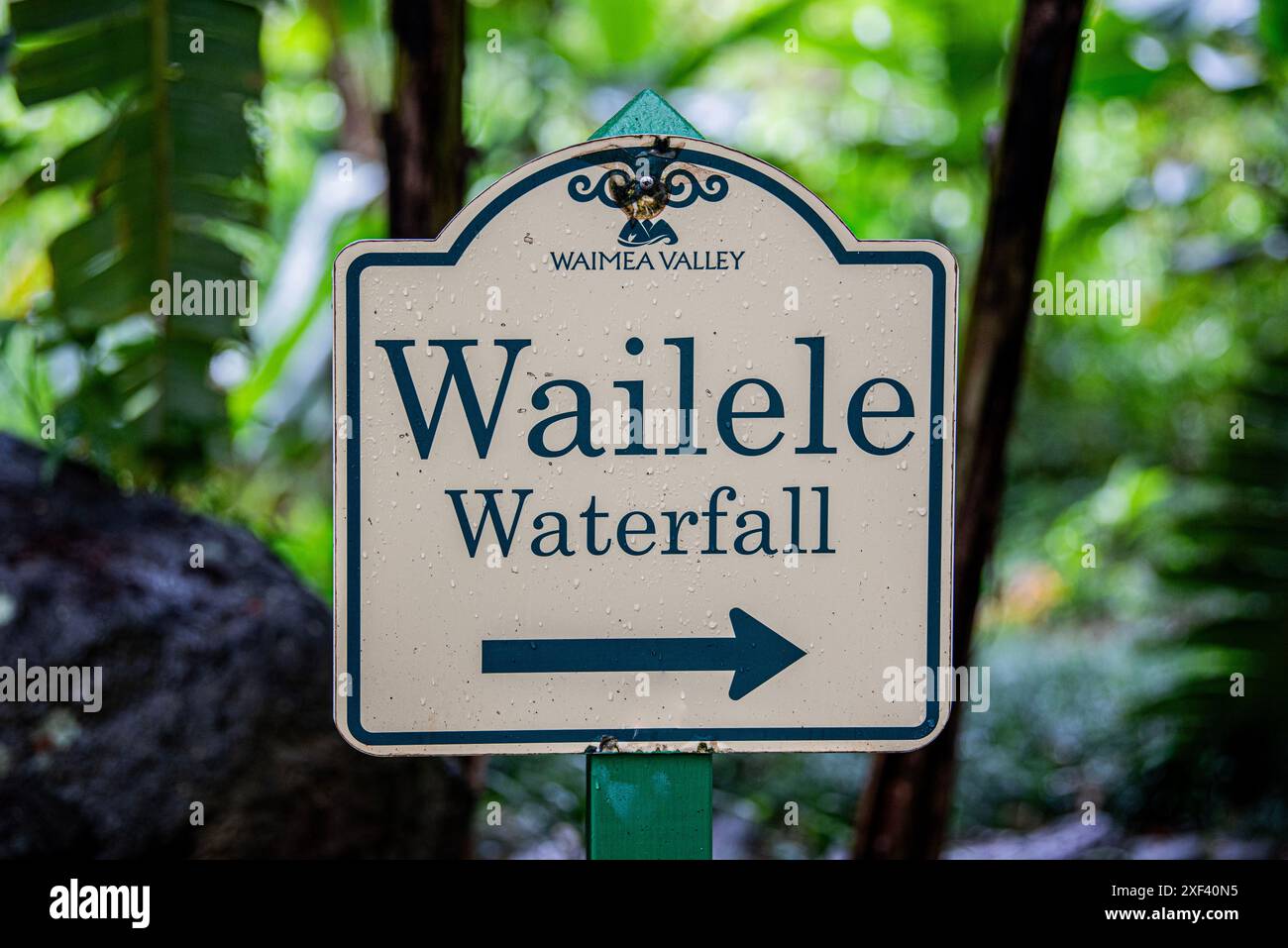 A sign reading 'Wailele Waterfall' located in Waimea Valley, Honolulu ...