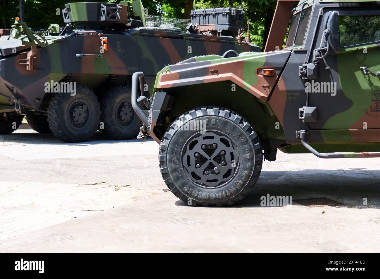 Army military base parking lot with an armored personnel carrier and a ...