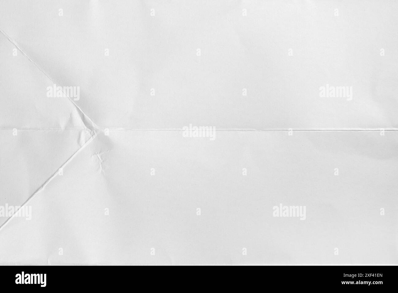 White surface of used folded paper with straight folds after packaging ...