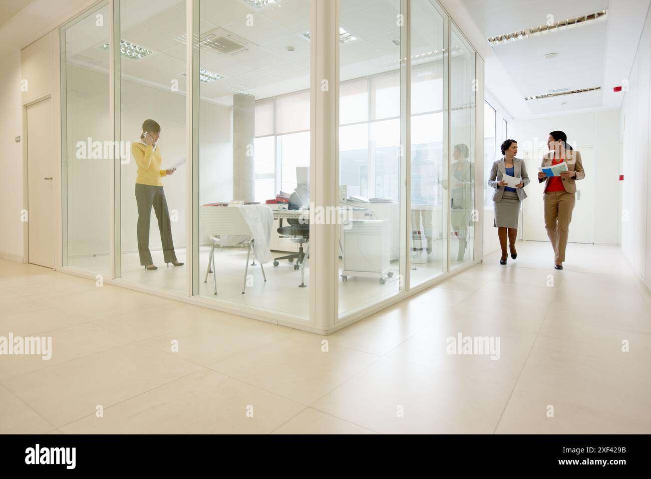 Office corridors people walking hi-res stock photography and images - Alamy