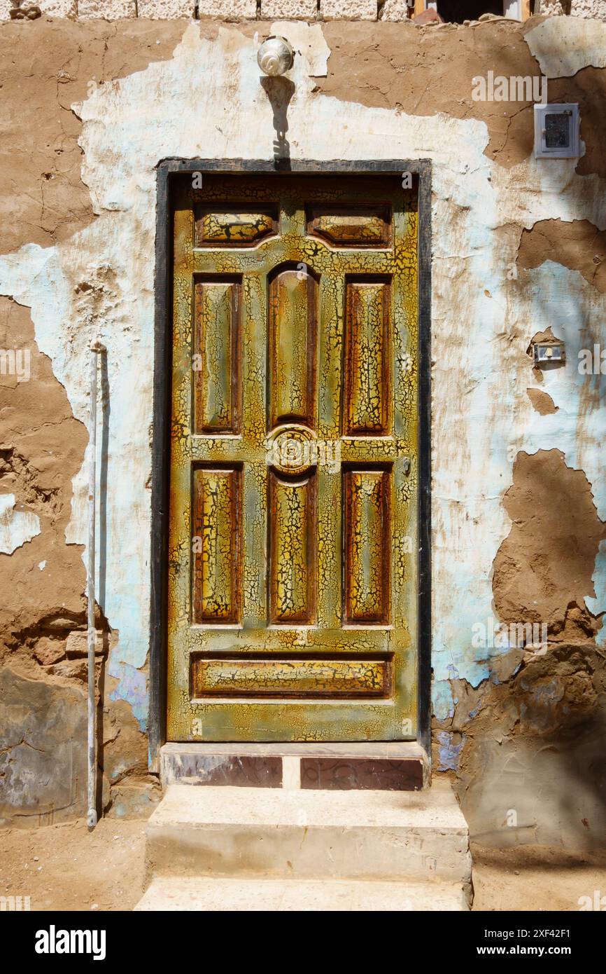 Weather beaten, cracked paint on door in Nubian village, Aswan, River ...