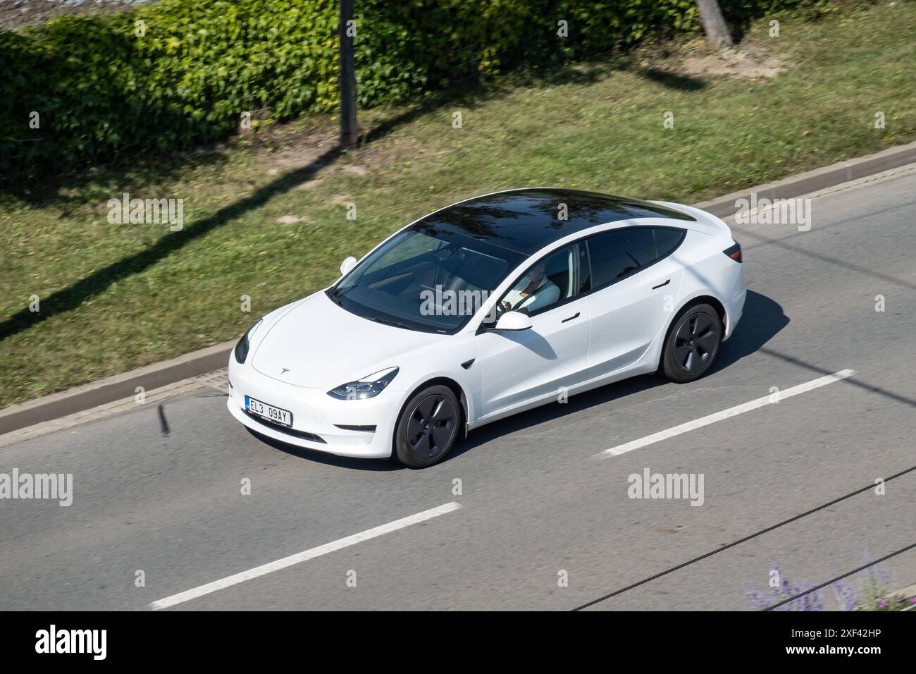 OSTRAVA, CZECH REPUBLIC - SEPTEMBER 13, 2023: White Tesla Model 3 sedan ...