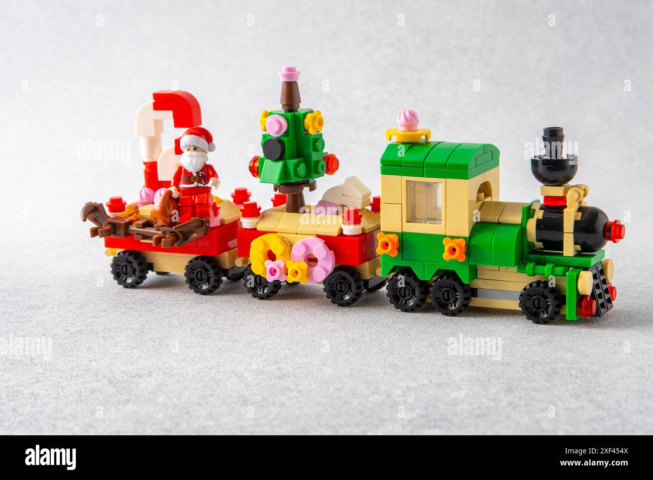 Christmas tree and Santa Claus train toy. Lego constructor from mini ...