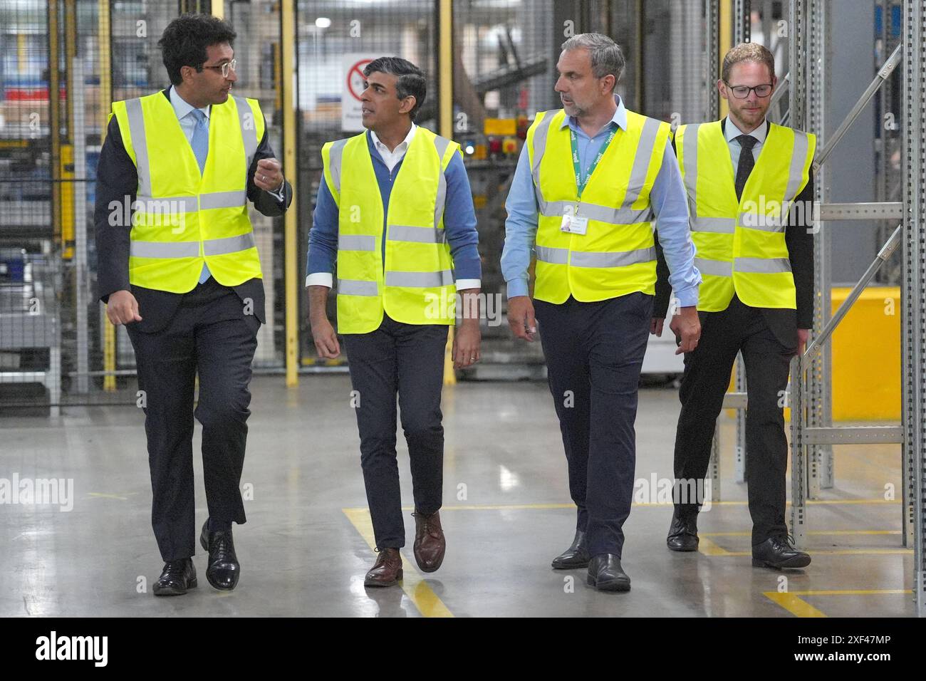 (left to right) Director Haider Choudrey, Prime Minister Rishi Sunak ...