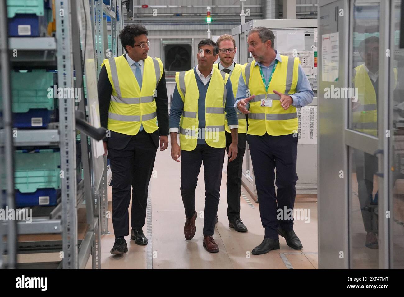 (left to right) Director Haider Choudrey, Prime Minister Rishi Sunak ...