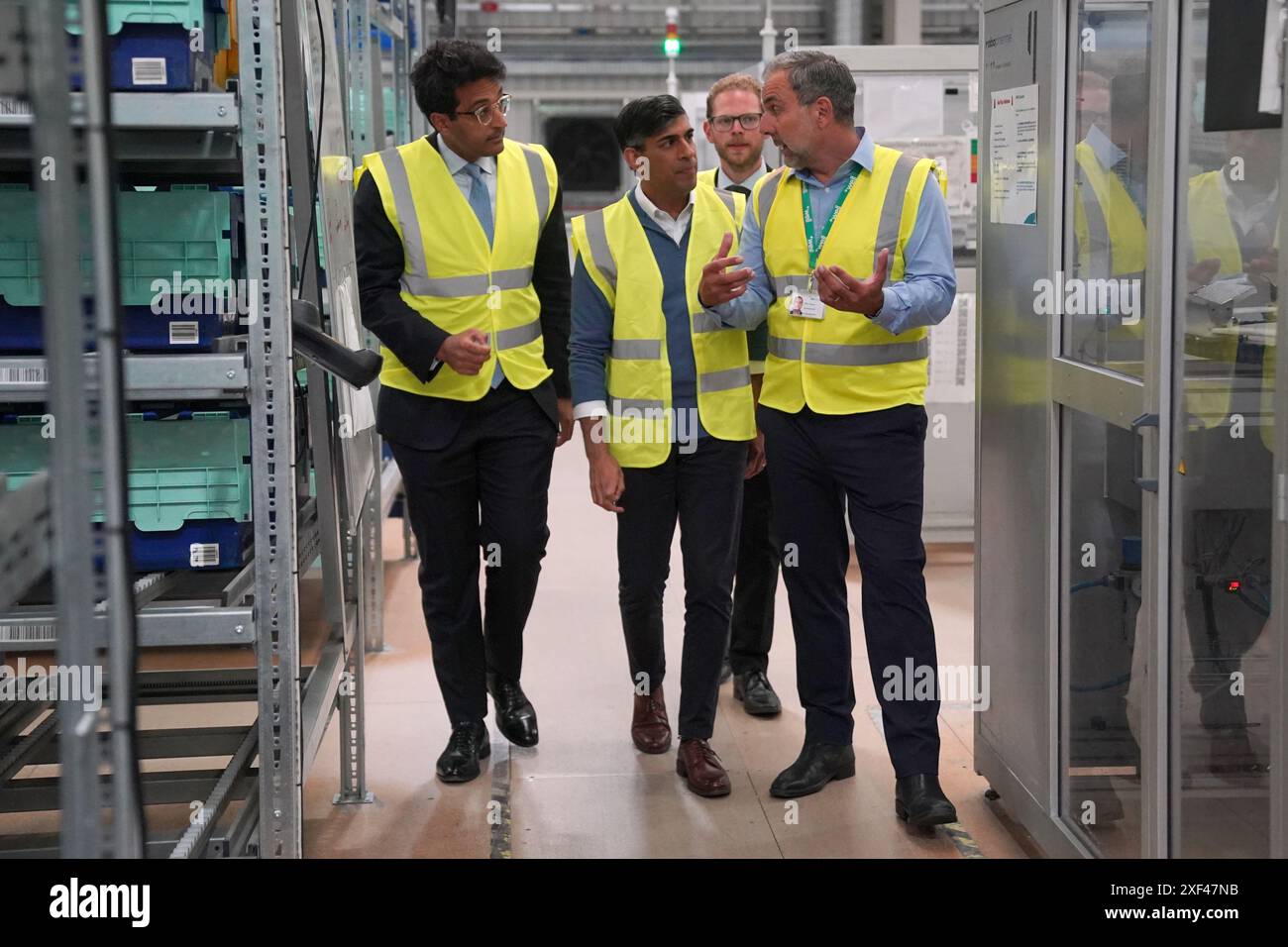 (left to right) Director Haider Choudrey, Prime Minister Rishi Sunak ...