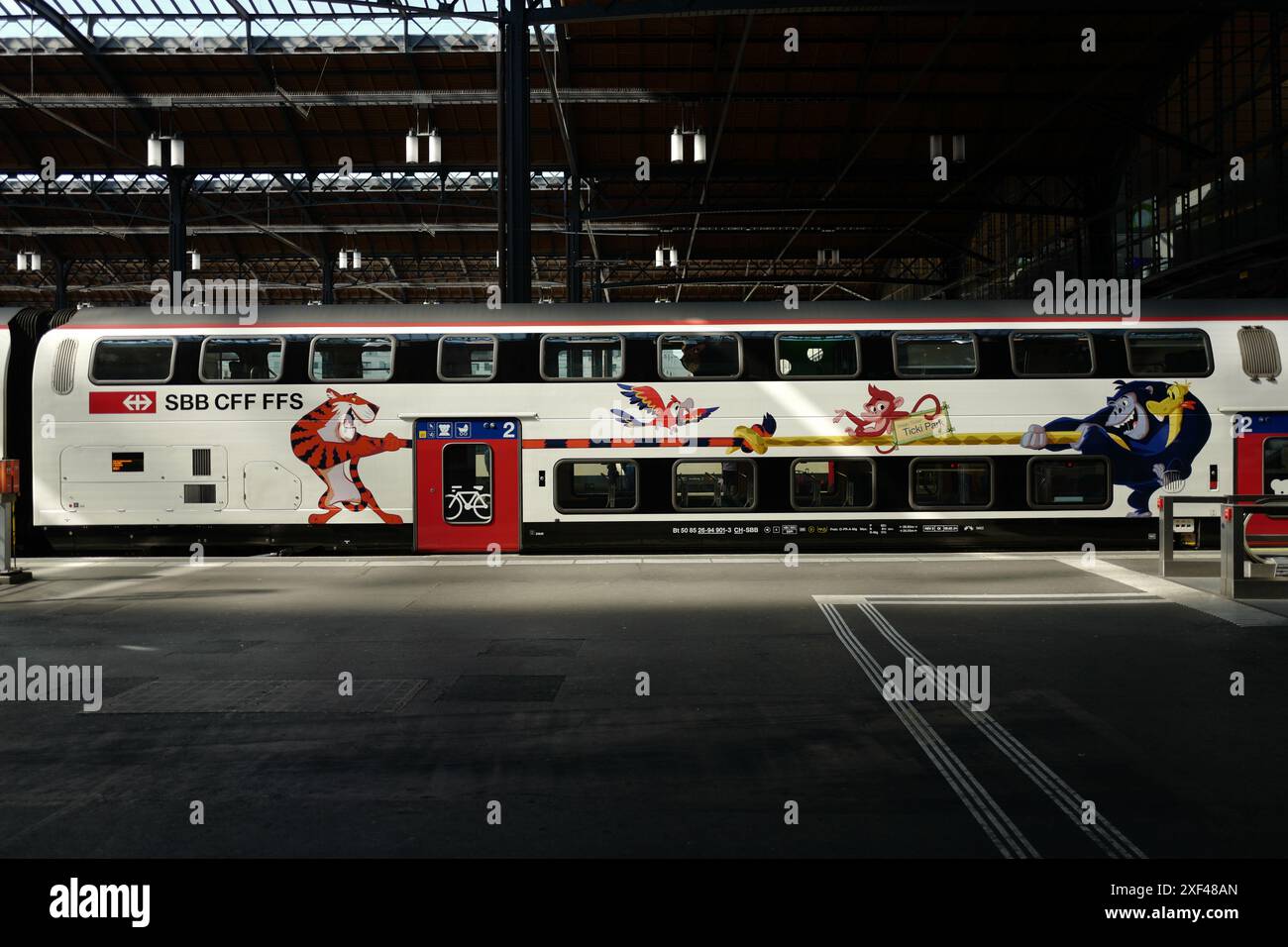 Colorful double decker railway car at the Basel SBB railway station ...