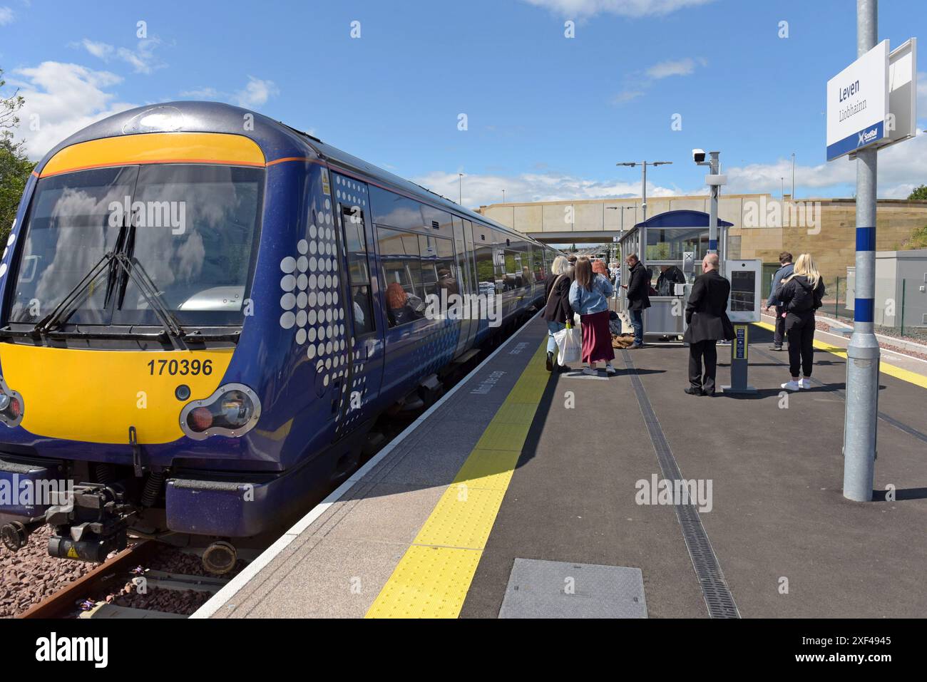 Passengers catching a Scotrail Class 170 DMU train at the newly reopened Leven Railway Station ...
