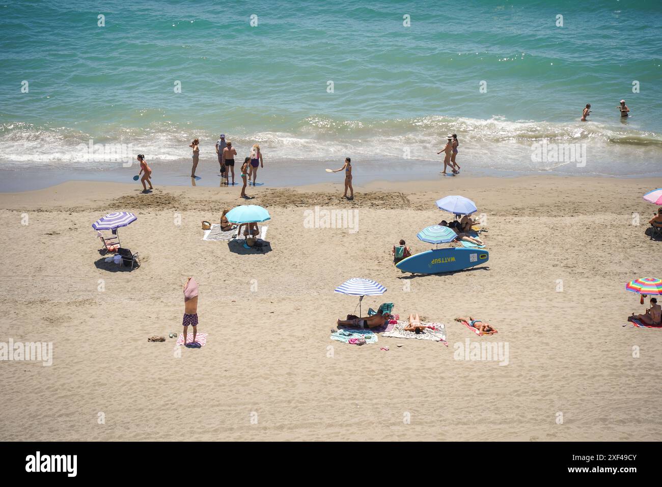 Beach waves spain tourists hi-res stock photography and images - Alamy