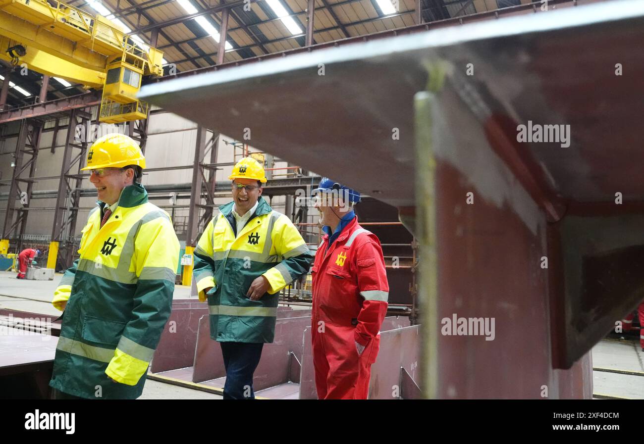 Scottish Labour leader Anas Sarwar(c) during a visit to the Harland ...