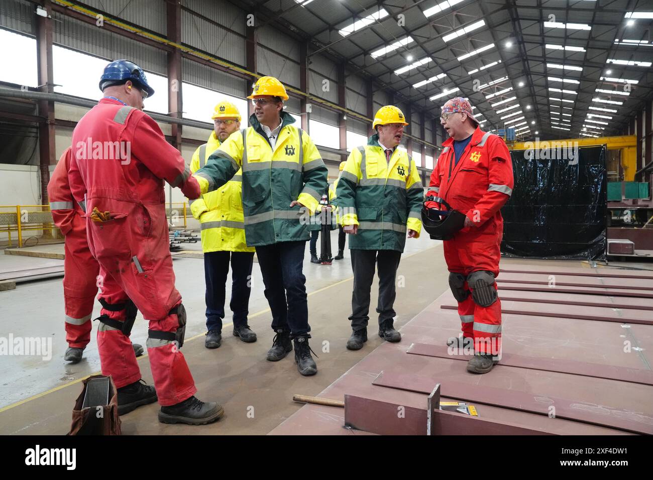 Scottish Labour leader Anas Sarwar chats to workers during a visit to ...