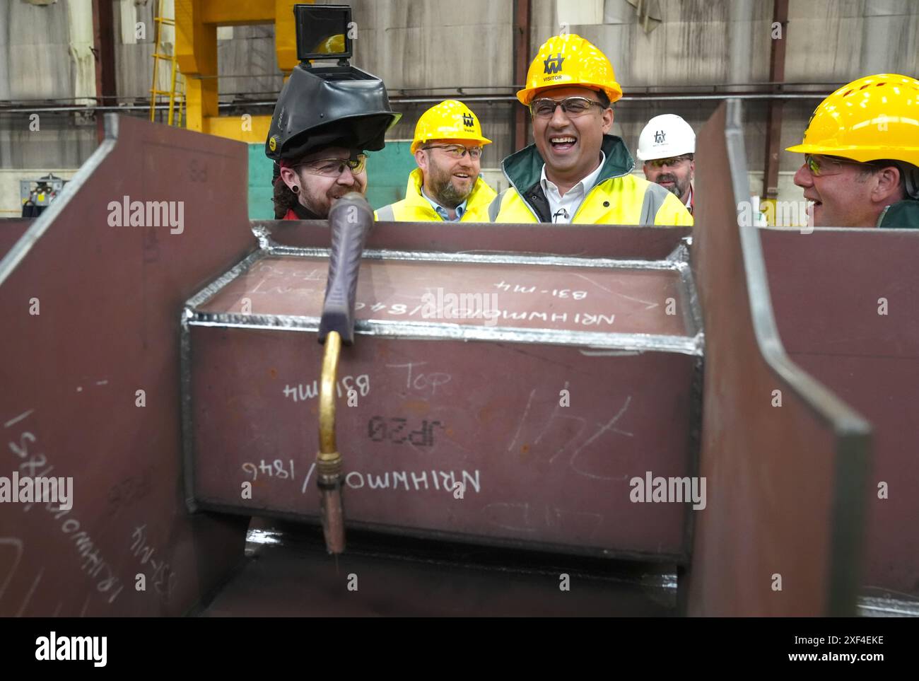 Scottish Labour leader Anas Sarwar chats to a worker during a visit to ...
