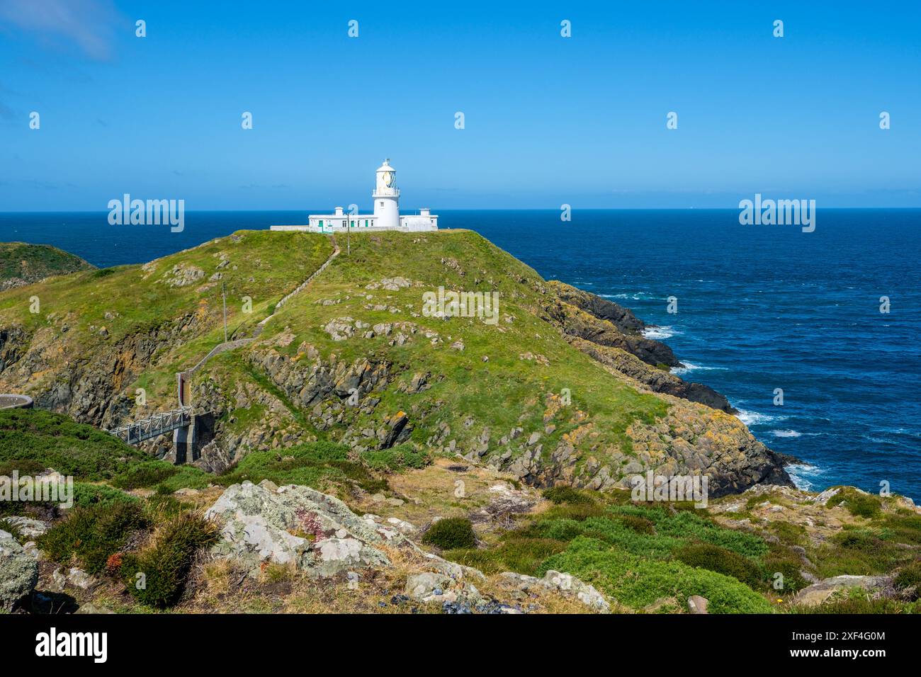 Strumble Head lighthouse on the Pembrokeshire Coast in Wales Stock ...