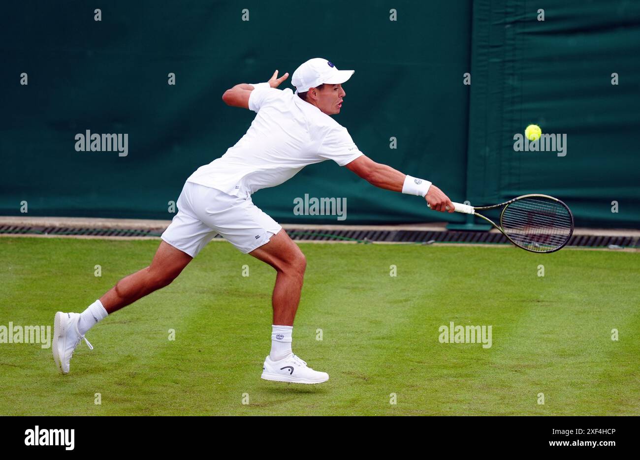Charles Broom in action against Stan Wawrinka (not pictured) on day one ...