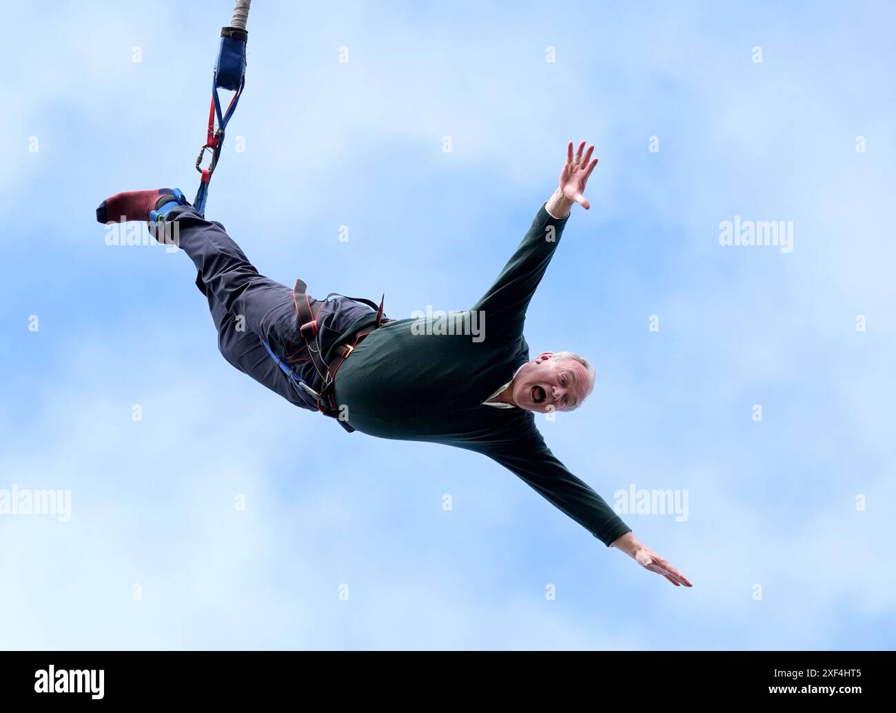 Liberal Democrat leader Sir Ed Davey taking part in a bungee jump ...