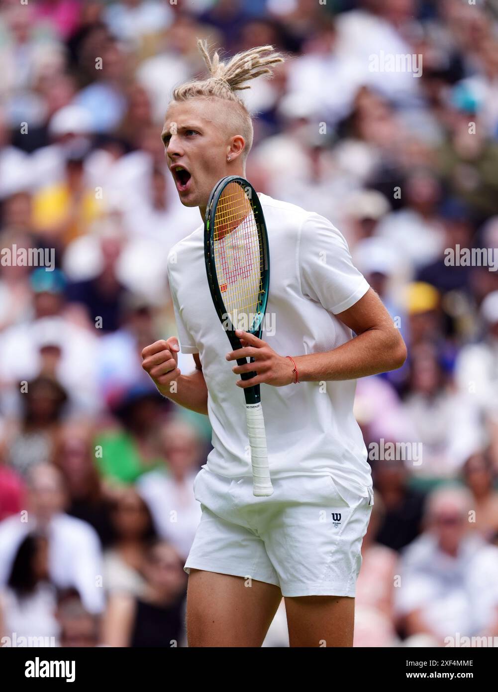 Mark Lajal celebrates breaking serve in the first set against Carlos ...