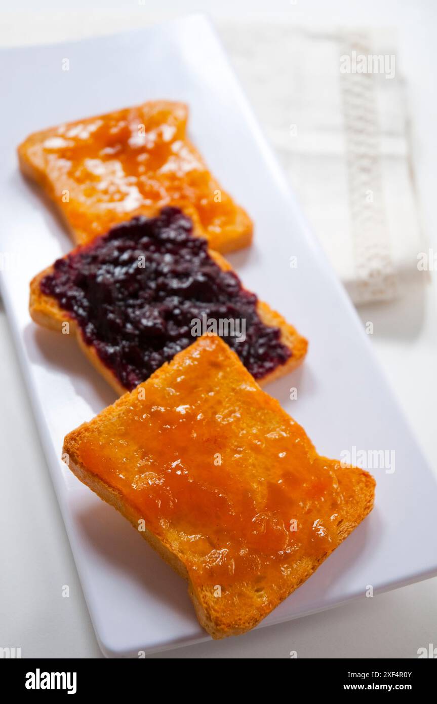 Three toasts with jam. Close view Stock Photo - Alamy