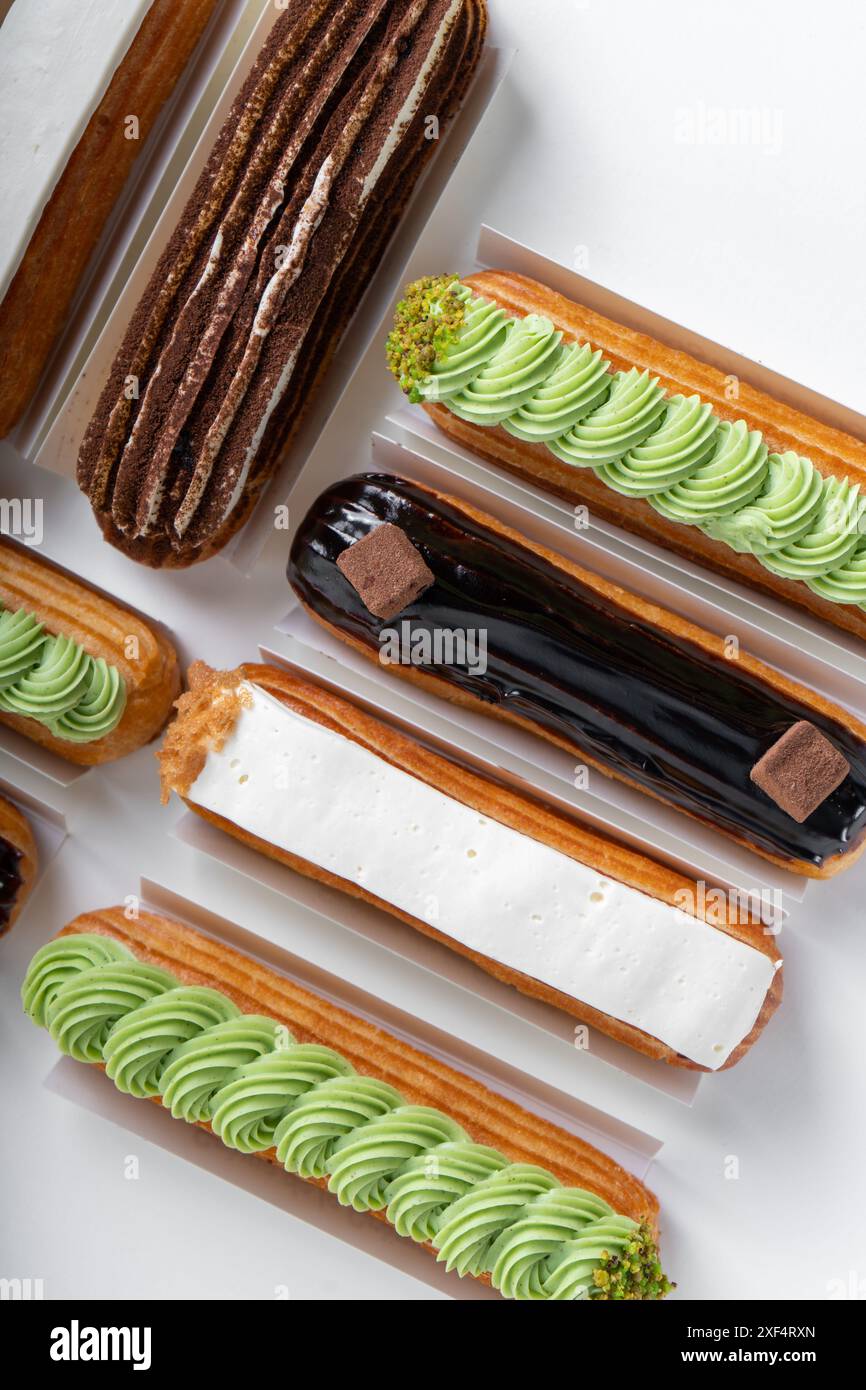Eclairs Selection, Different Delicious Eclairs on White Background ...