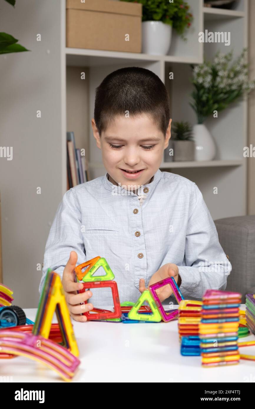 Preschool boy builds tower from hi-res stock photography and images - Alamy