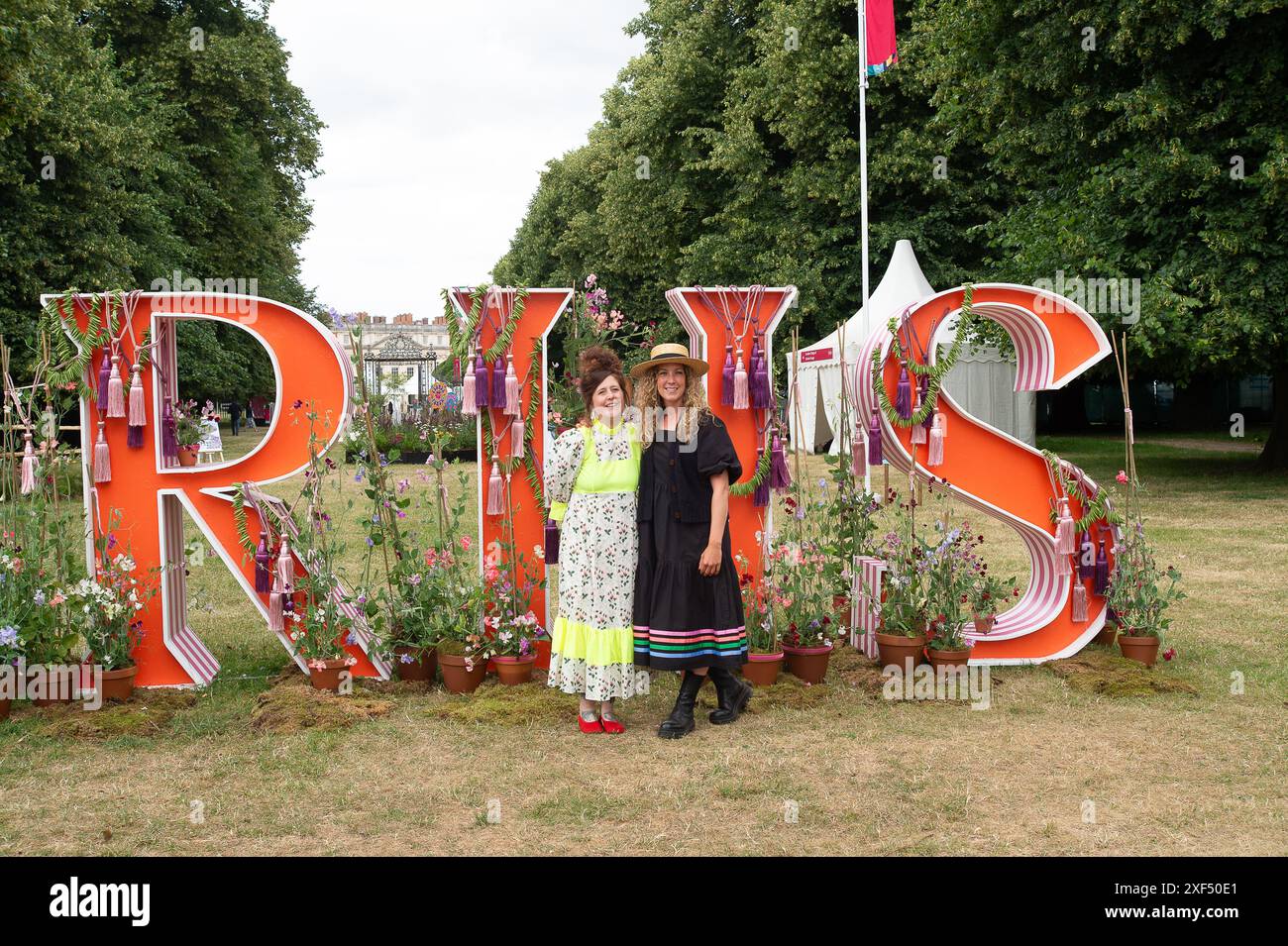 East Molesey, UK. 1st July, 2024. Designer Sophie Powell (L) with her ...