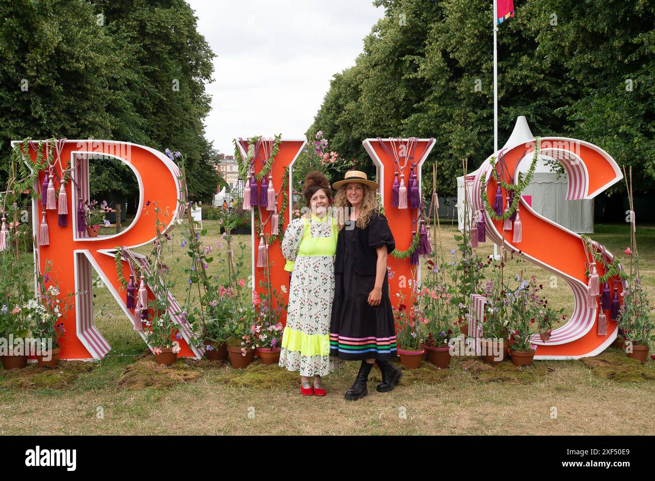 East Molesey, UK. 1st July, 2024. Designer Sophie Powell (L) with her ...