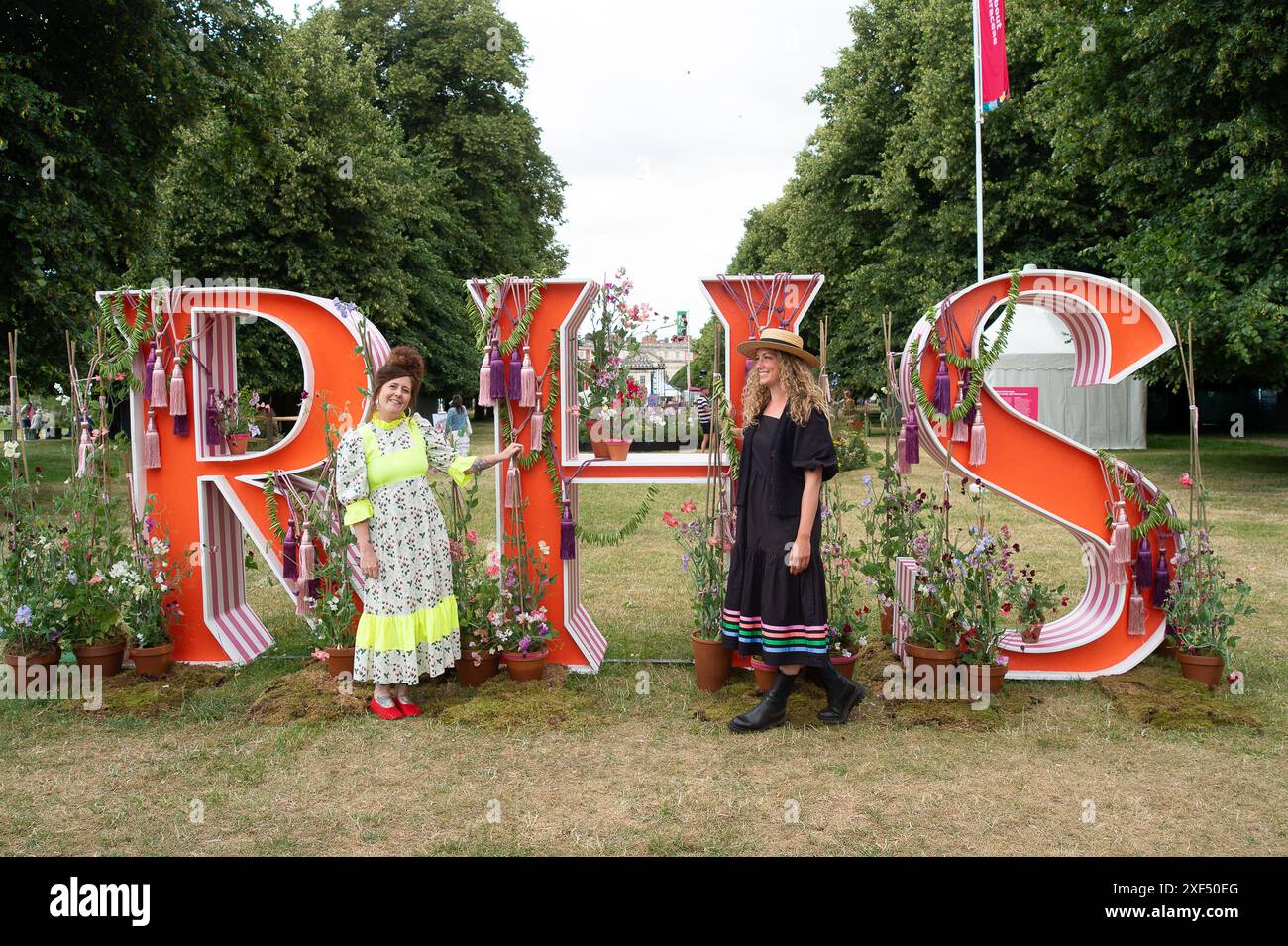 East Molesey, UK. 1st July, 2024. Designer Sophie Powell (L) with her ...