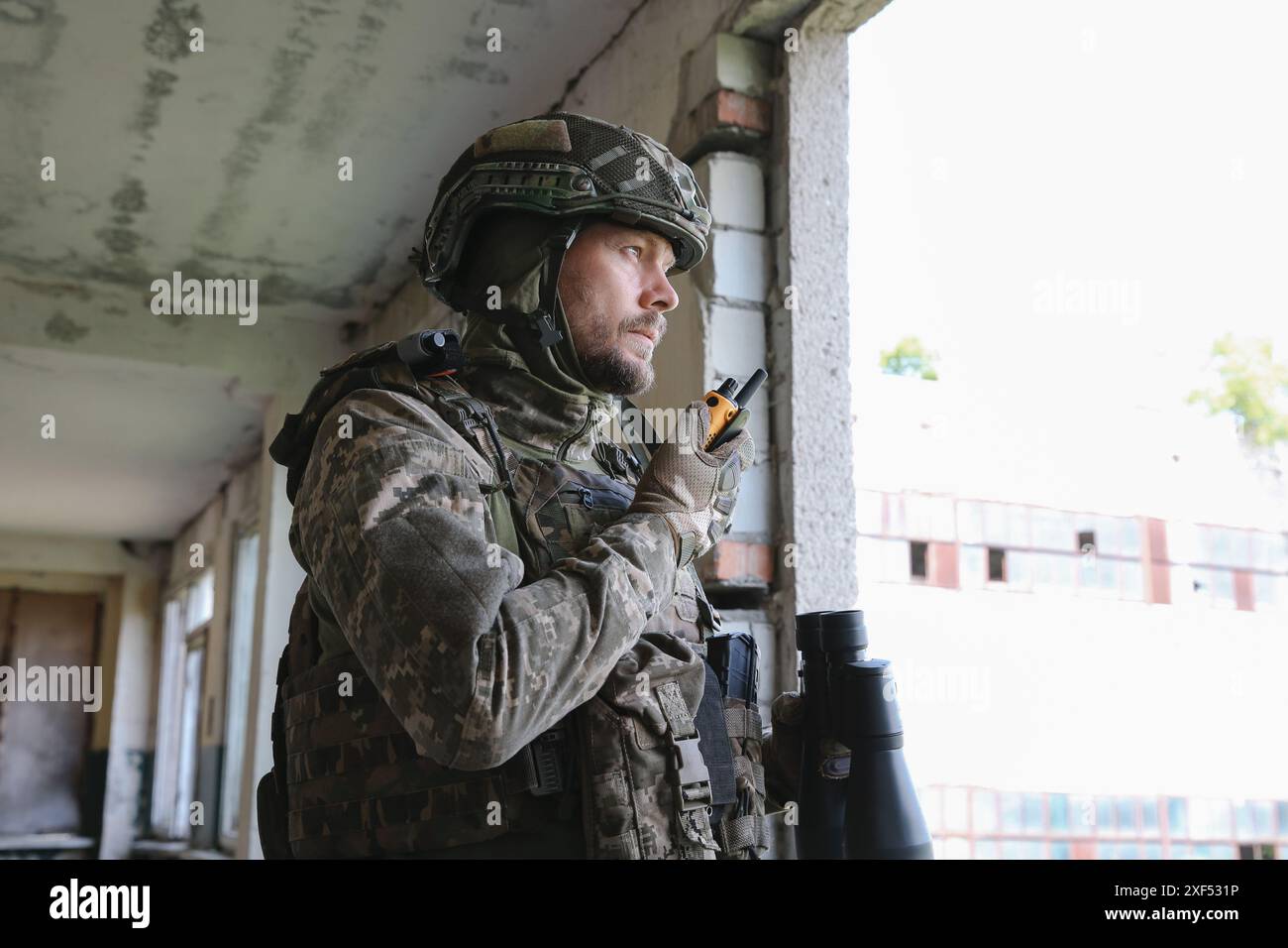 Military mission. Soldier in uniform with radio transmitter inside ...