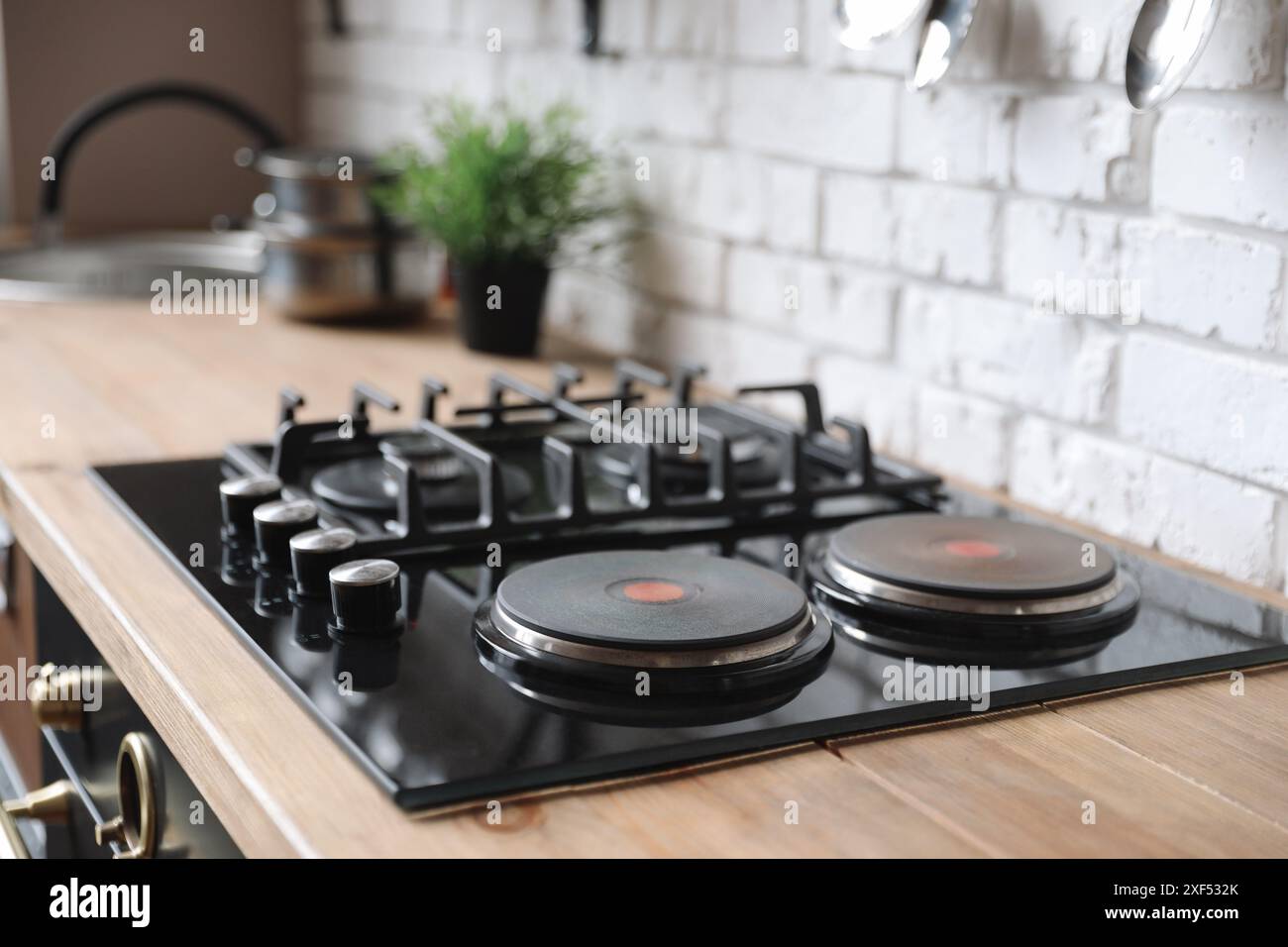 New modern stove with gas and electric burners in kitchen Stock Photo ...
