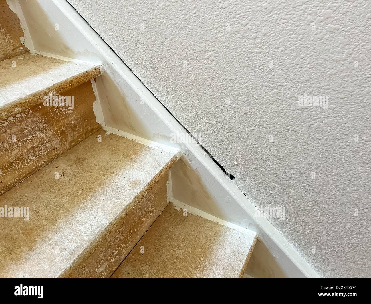 Close-Up View of Staircase Under Renovation with Unfinished Steps and ...