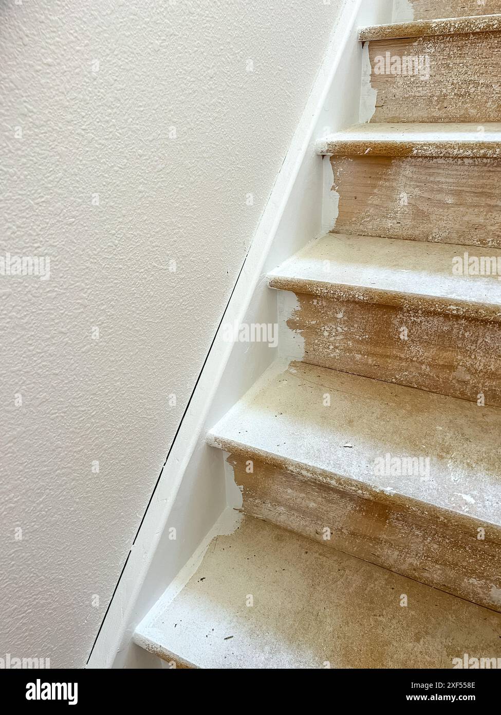 Close-Up View of Staircase Under Renovation with Unfinished Steps and ...