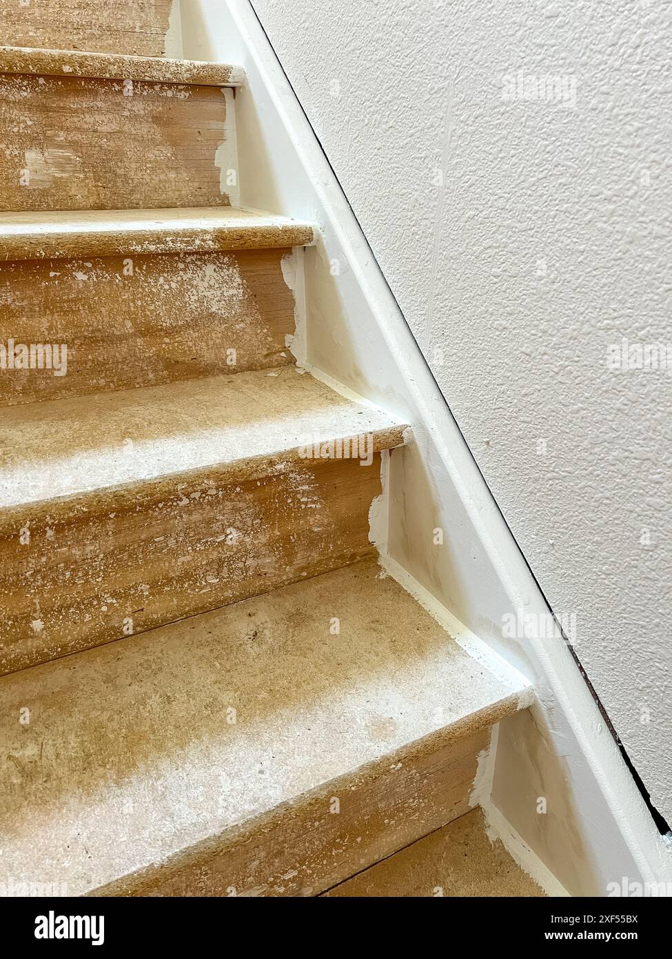 Close-Up View of Staircase Under Renovation with Unfinished Steps and ...