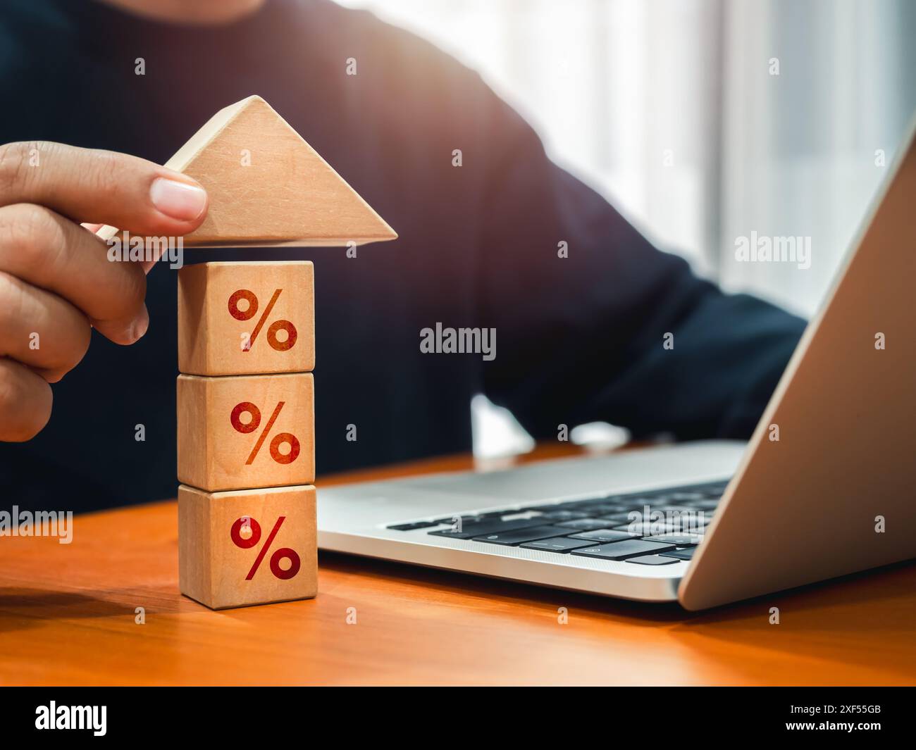 Percentage icon on wooden cube blocks stacked with big arrowhead ...