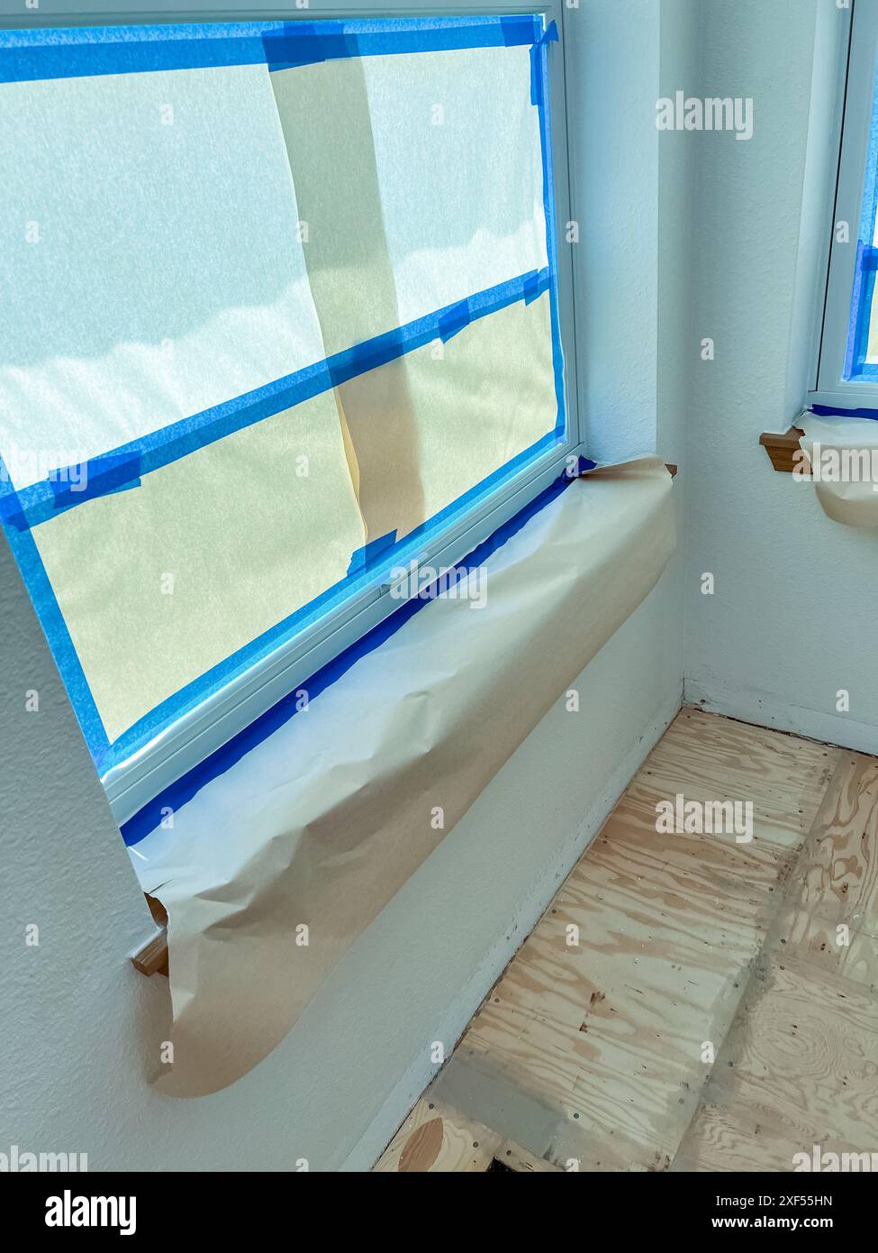 Windows Protected with Blue Tape and Paper During Home Renovation Stock ...