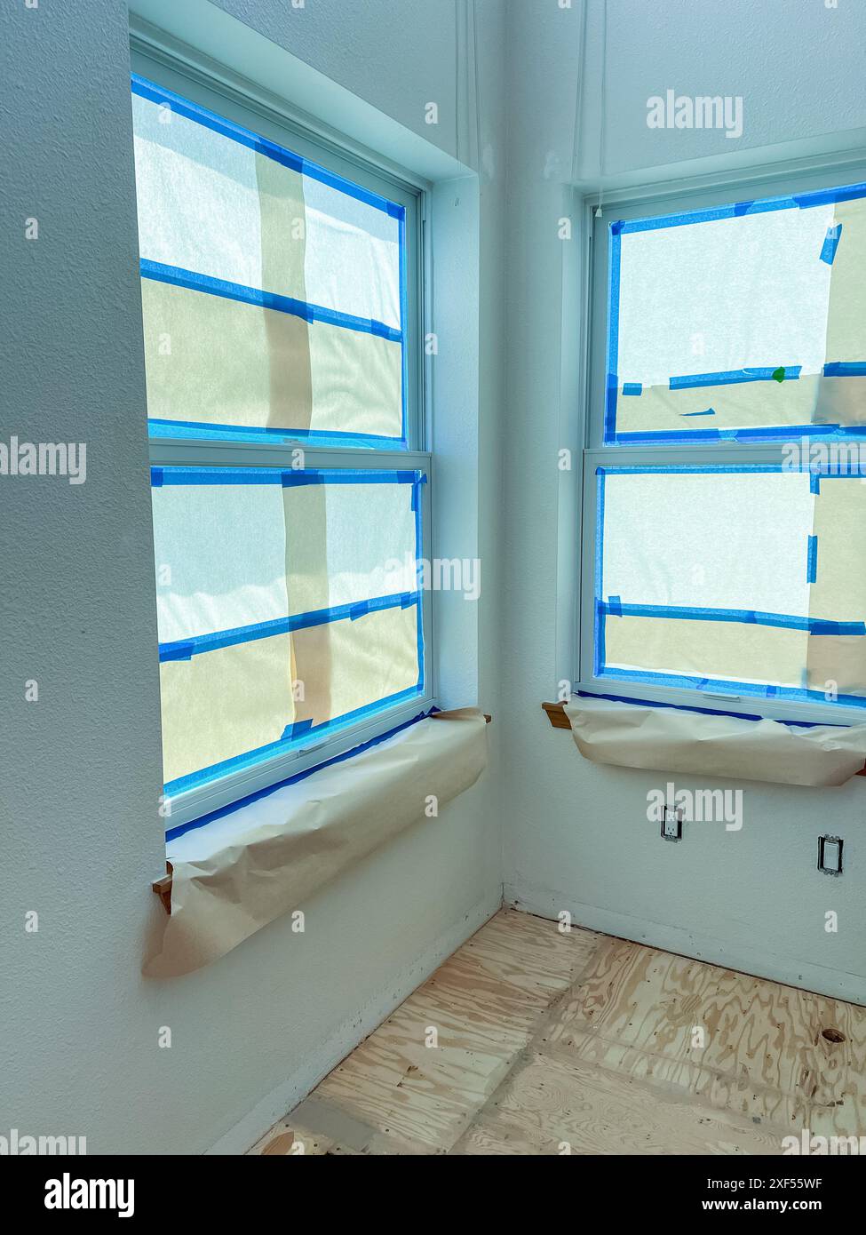 Windows Protected with Blue Tape and Paper During Home Renovation Stock ...