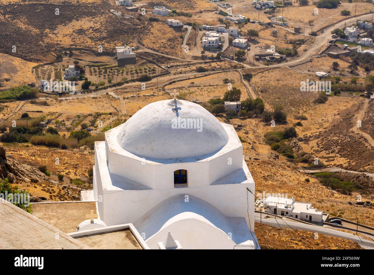 White Greek church on the hillside. Chora on Serifos island. Cyclades ...