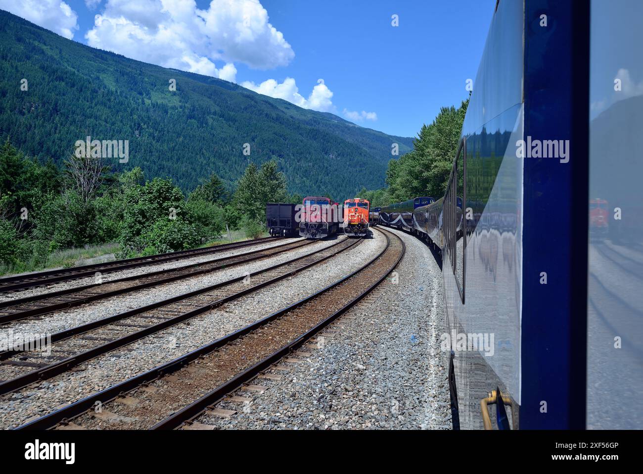 Cisco crossing, Canada - 22nd June 2023:The Rocky Mountainee ttrain passing CP and CN trains ...