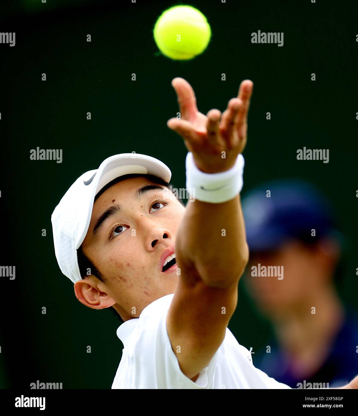 London, Britain. 1st July, 2024. Shang Juncheng serves the ball during ...