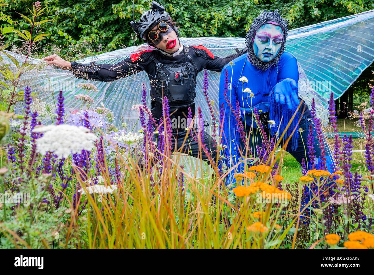 London, UK. 1 Jul 2024. Drag queens, dressed in full bug inspired drag ...