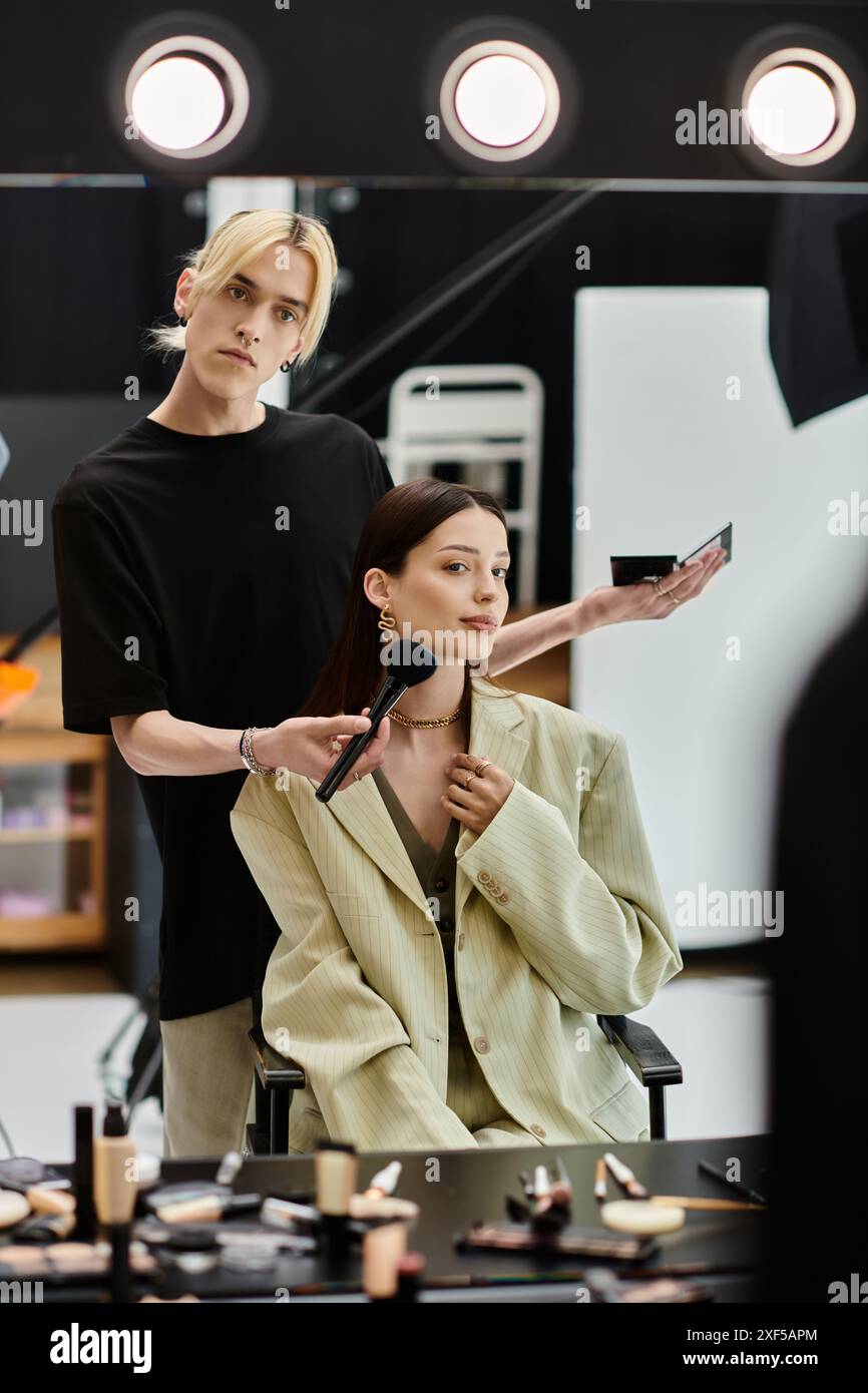 A woman receives a stylish makeover from a talented male stylist Stock ...