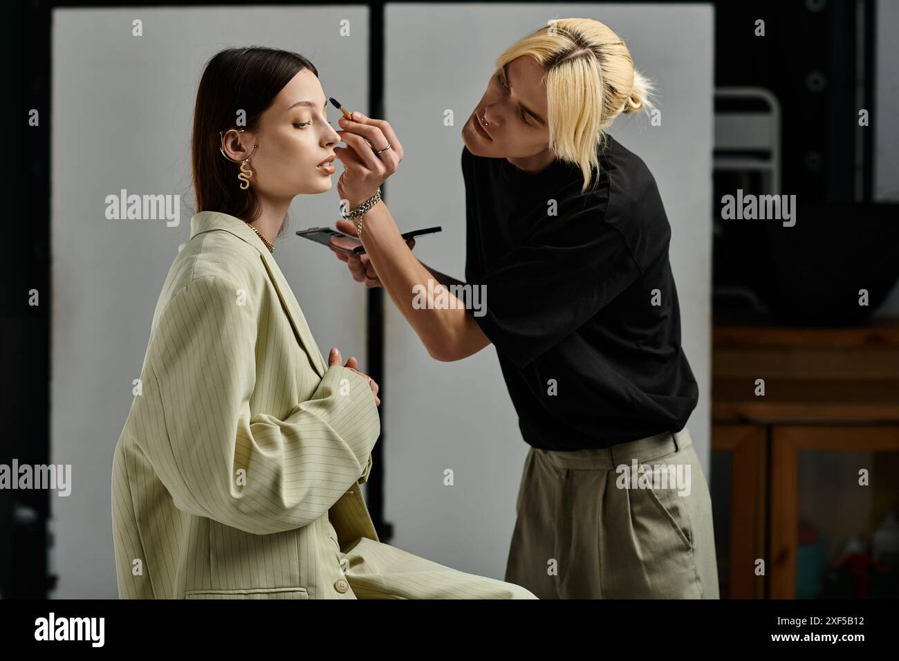 Professional makeup artist enhancing hi-res stock photography and ...