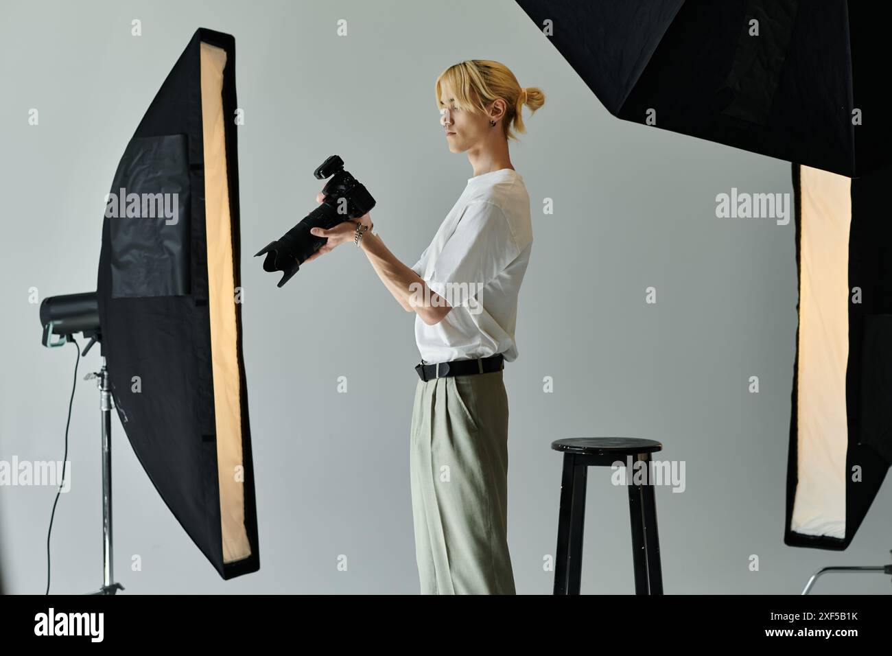 Man taking photographs on camera Stock Photo - Alamy