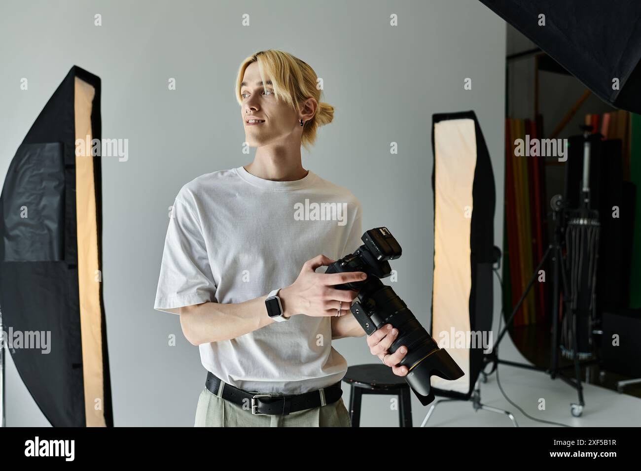 A man capturing holding camera Stock Photo - Alamy