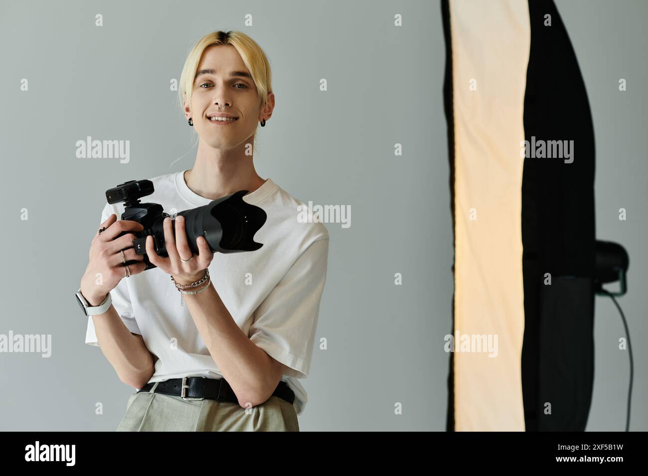 Professional camera man holds photo hi-res stock photography and images ...