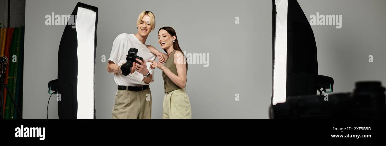 A man shows photos of a female model Stock Photo - Alamy