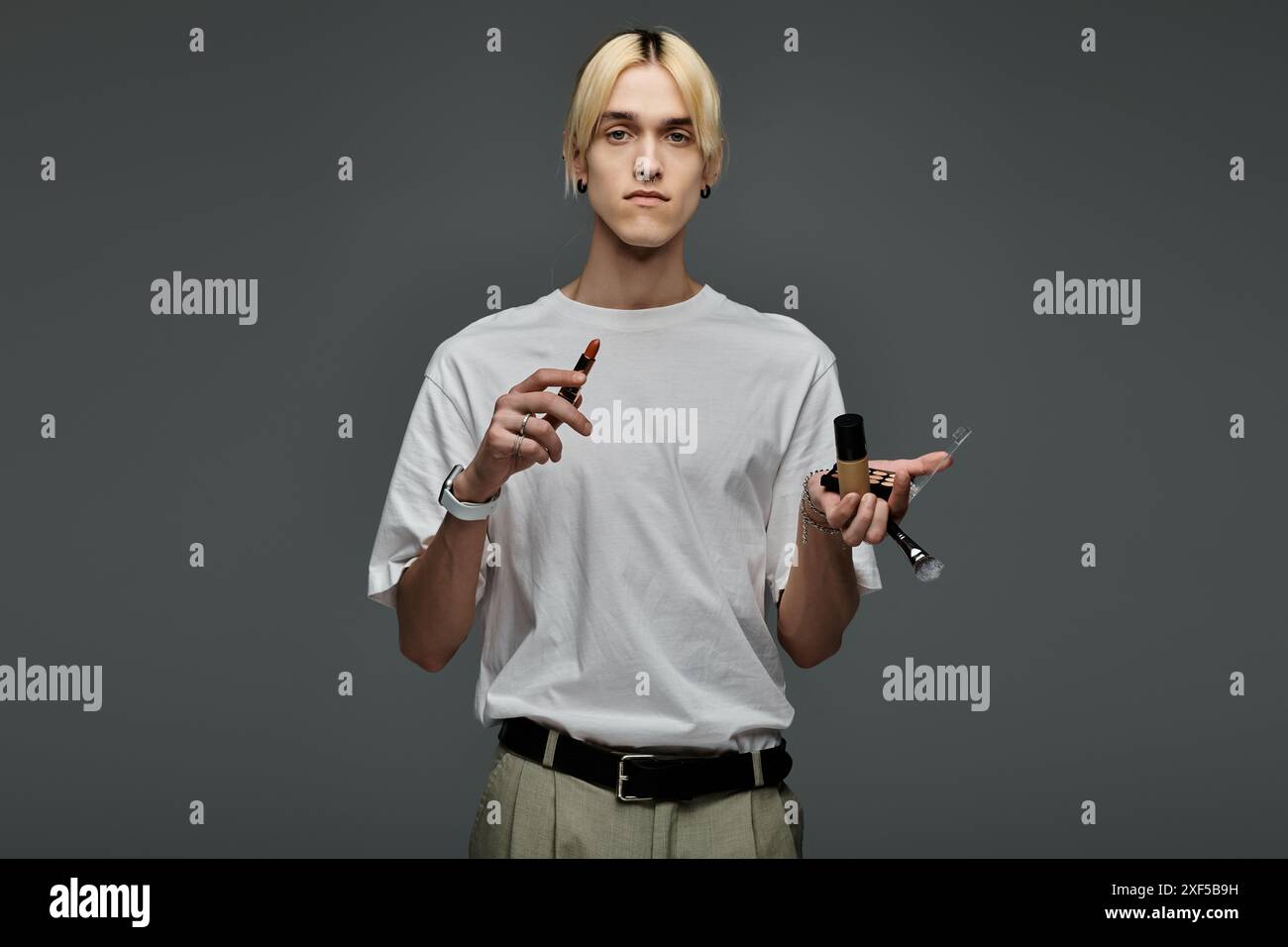 Talented man holding highlighter in hand Stock Photo - Alamy