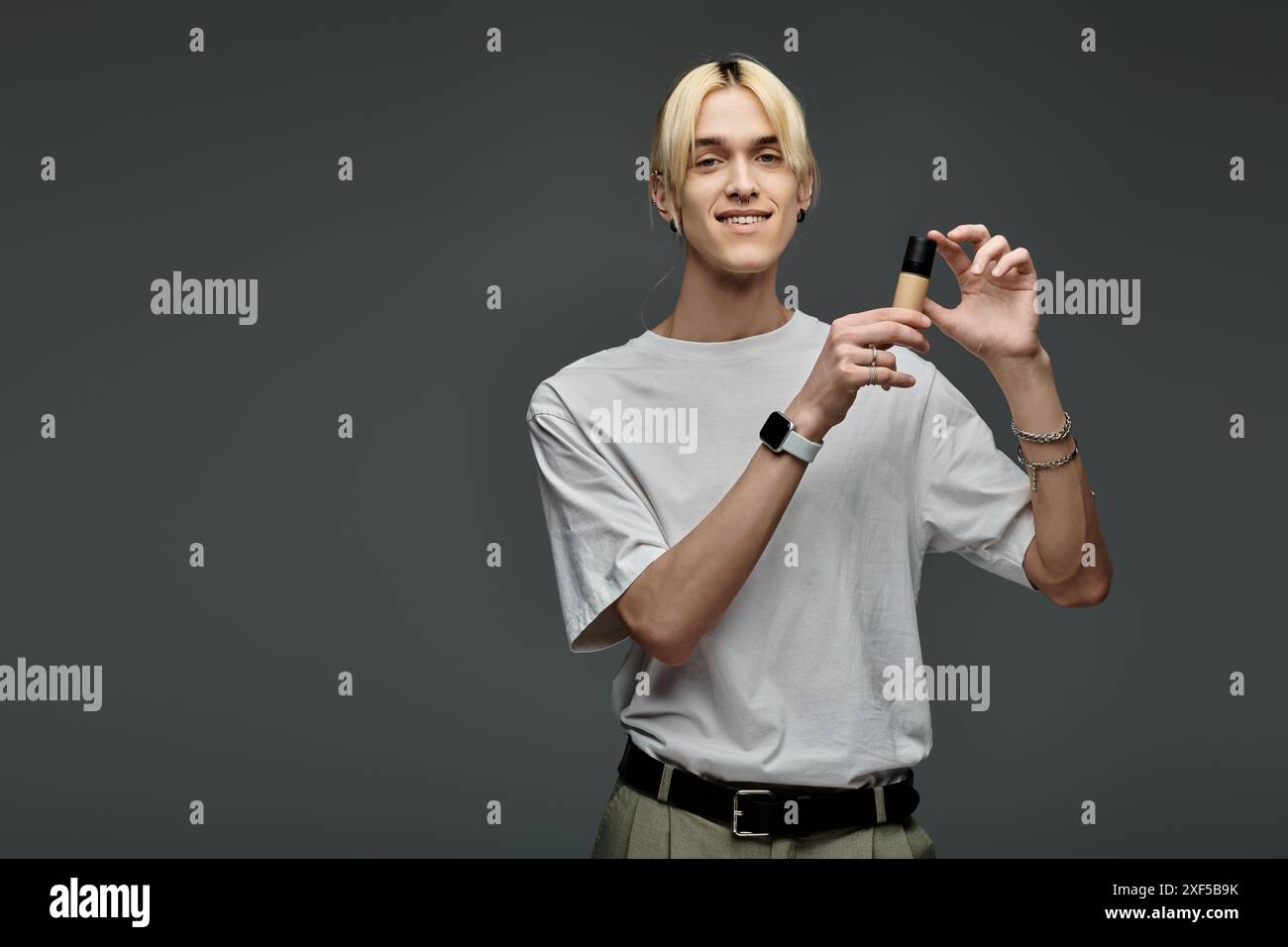 A man confidently holding a highlighter in his right hand Stock Photo ...