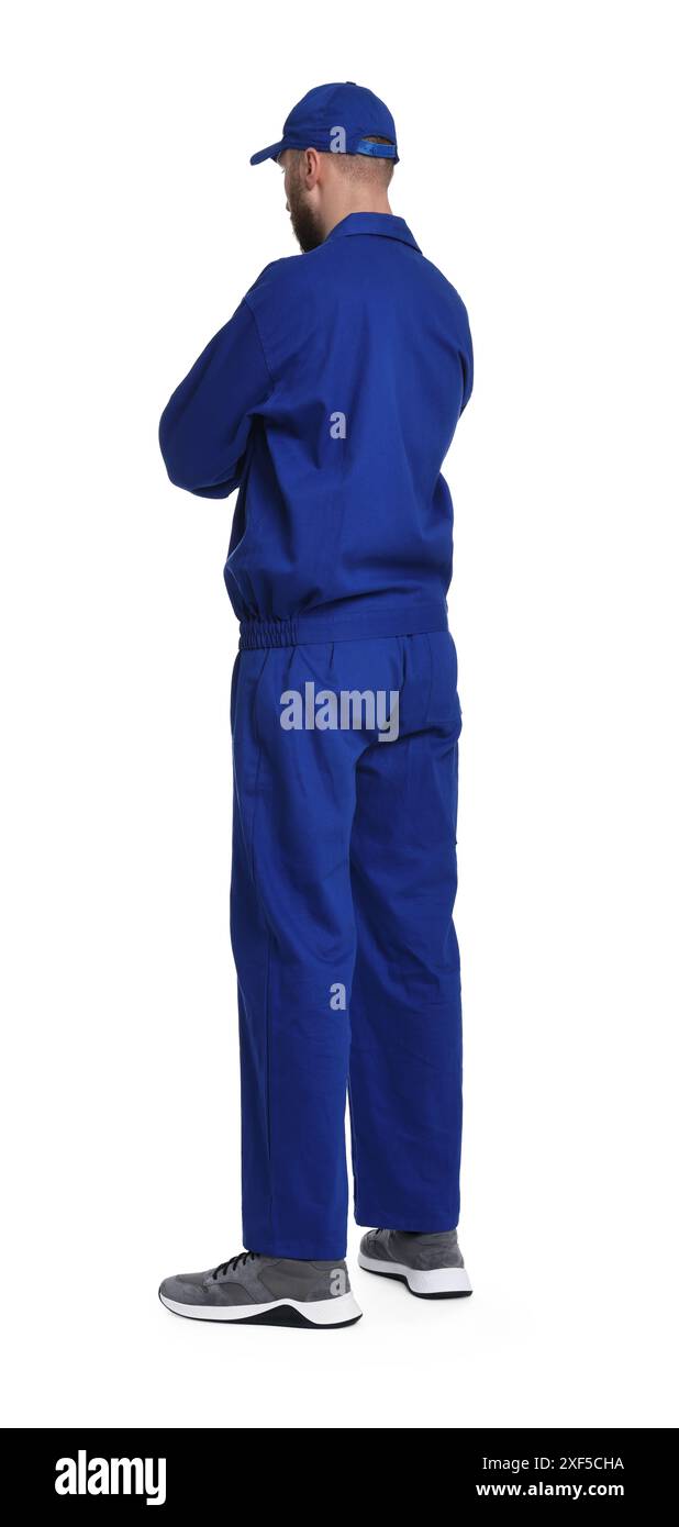 Professional auto mechanic in blue uniform on white background, back ...