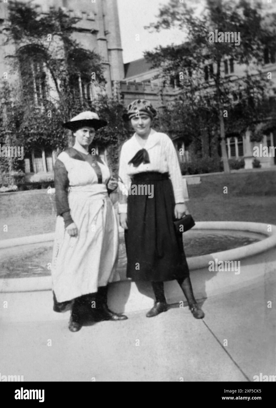 Two ladies in a courtyard. From a photograph album c1920s, original ...